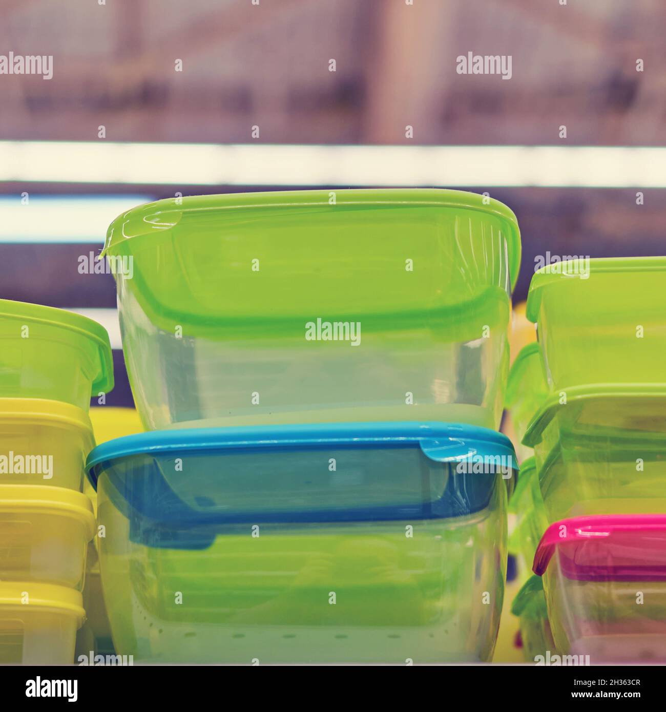 Plastic dishes and containers are sold on the shelves in the store ...