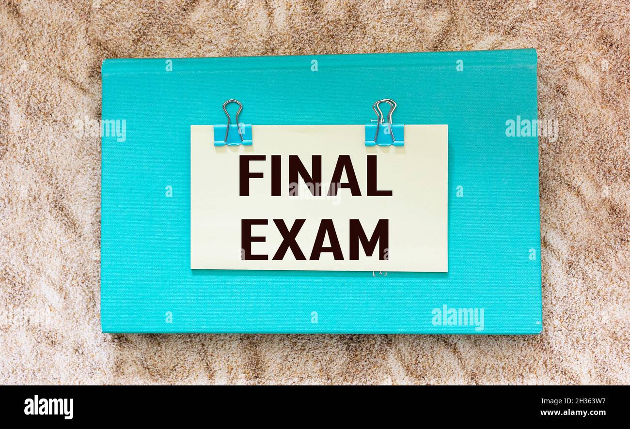 Final exams concept on green notepad and sand background Stock Photo ...