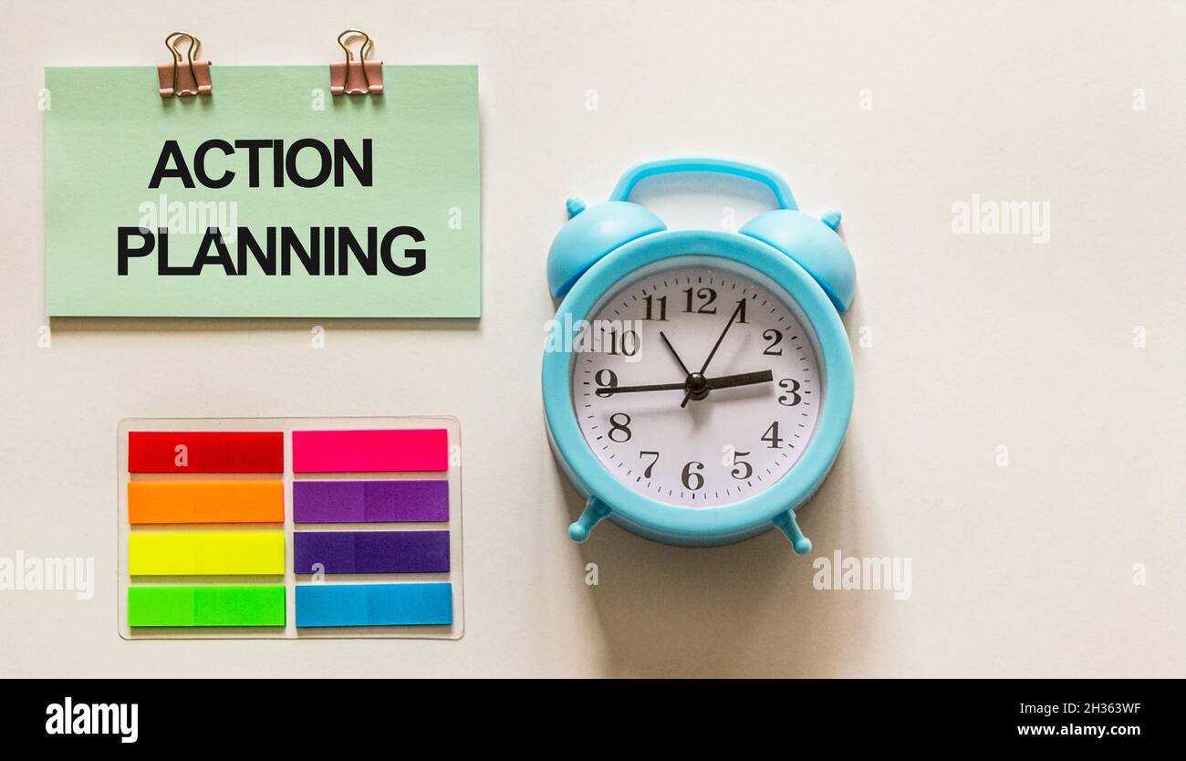 Action planning , text on a sticker, next to colored stickers and a ...