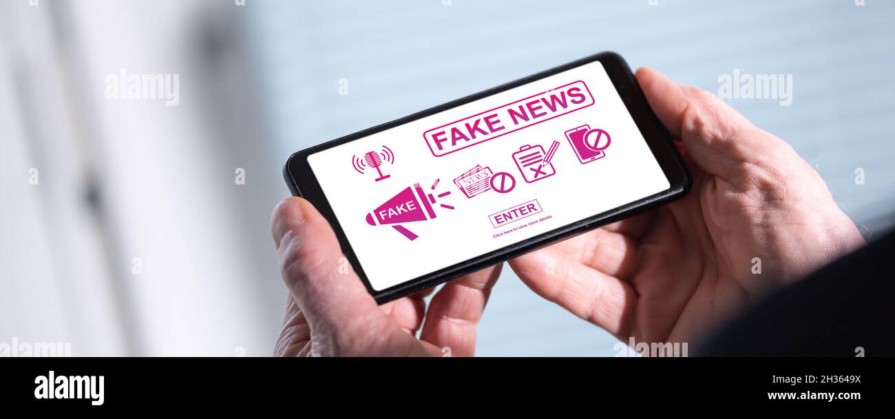Smartphone screen displaying a fake news concept Stock Photo - Alamy