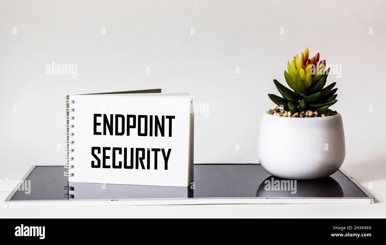 Handwritten Endpoint Security on Notepad. The concept refers to a ...