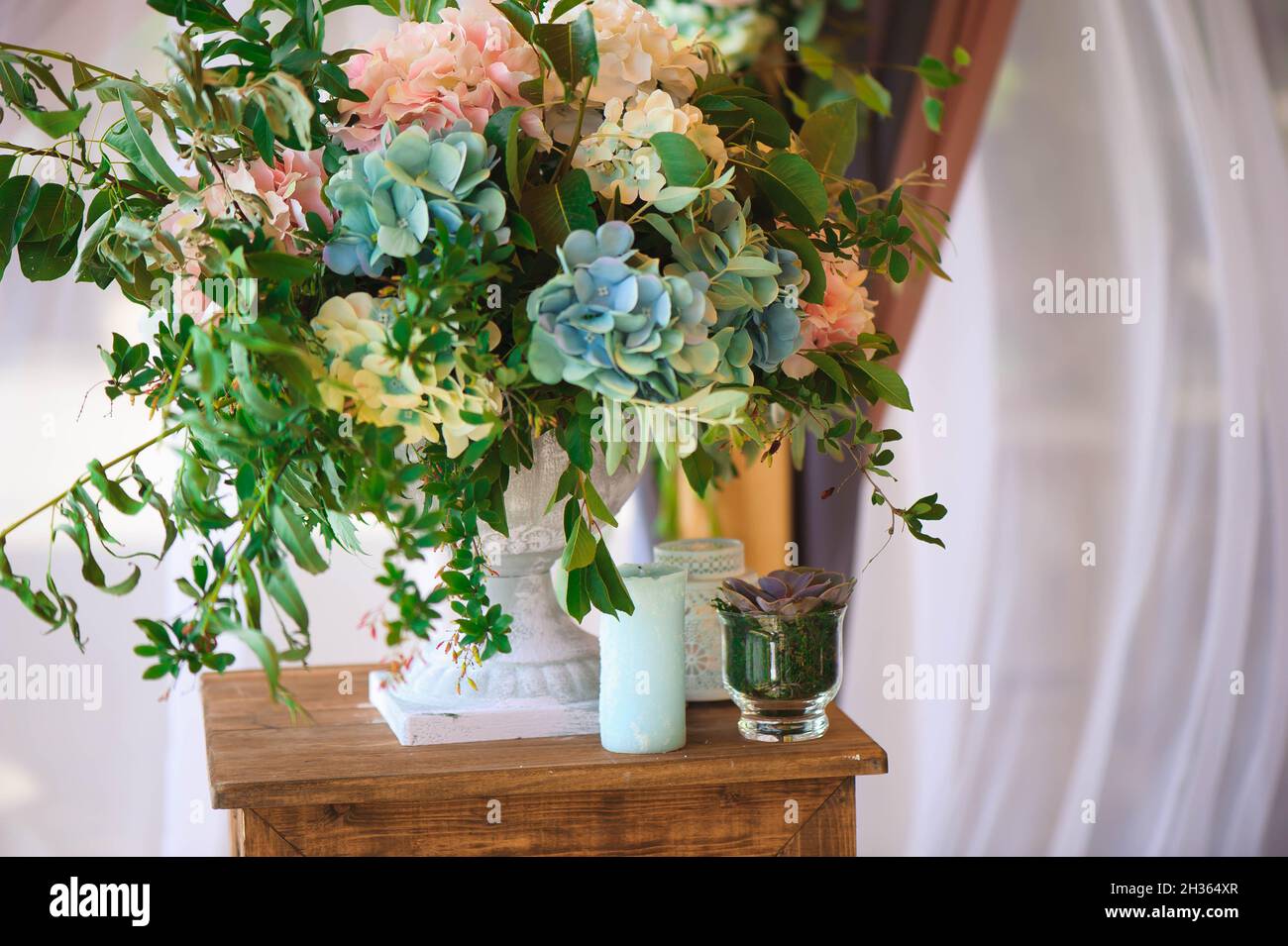 Wedding ceremony decoration, bunches of flowers, gifts. Beautiful ...