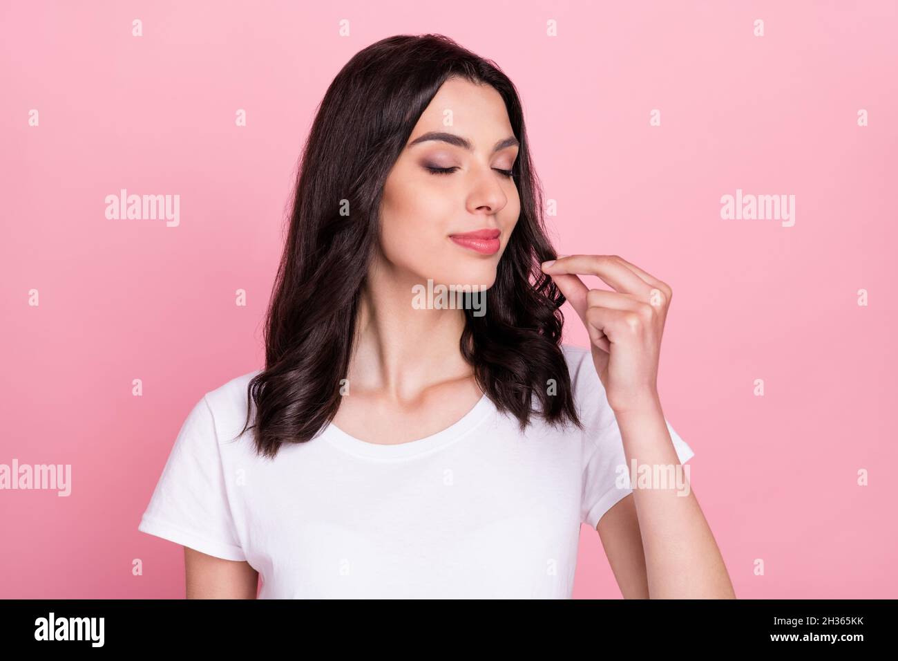 Photo of charming young happy calm woman make fingers chef sign tasty ...