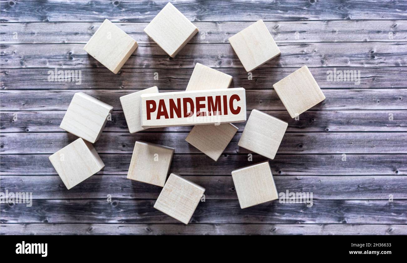 Pandemic, text is written on wooden blocks and gray table surface Stock ...