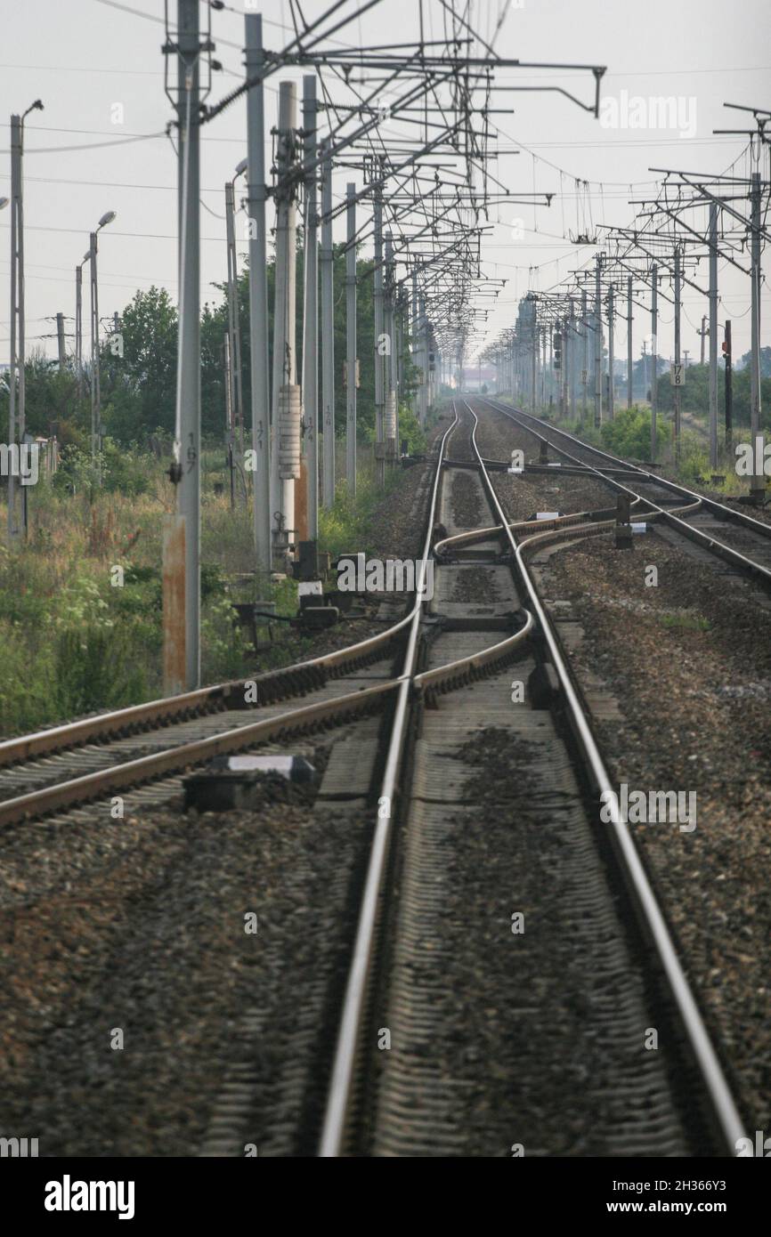 Cluj-Napoca, Romania, June 7, 2009: Converging railway rail tracks run ...