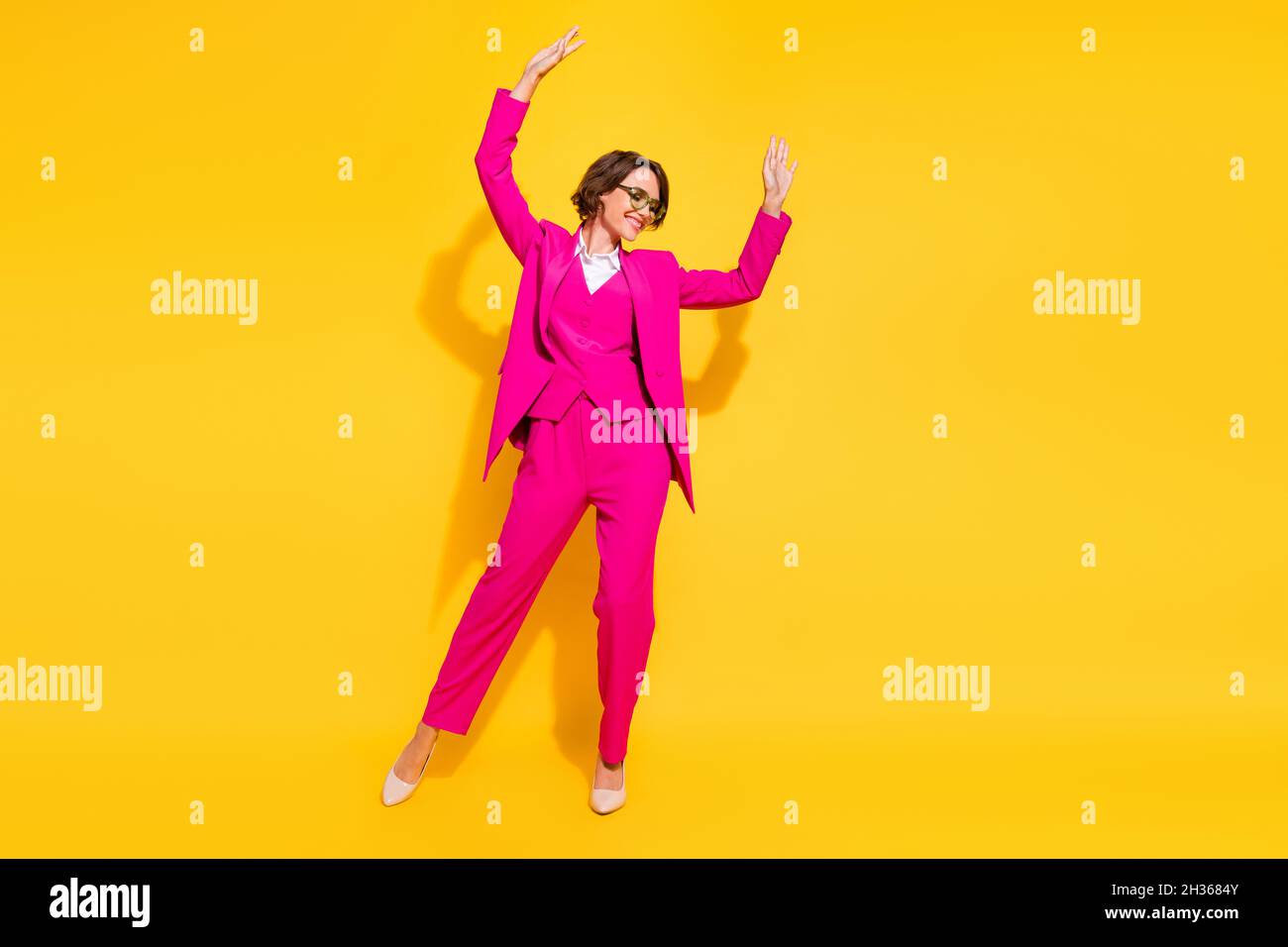 Photo of funny charming young lady wear pink suit spectacles dancing ...