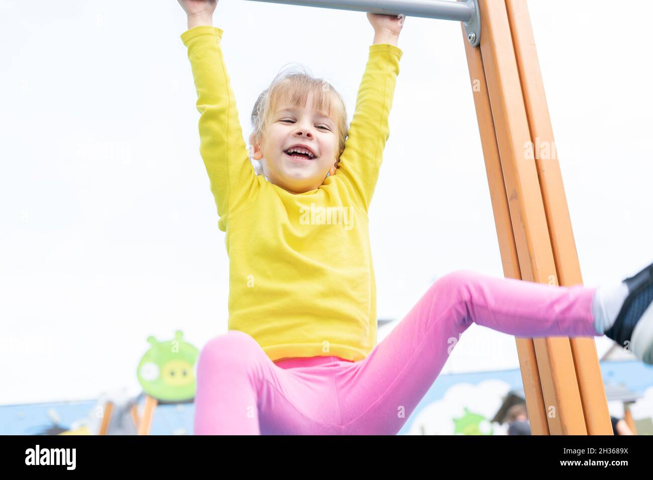 Child playing on outdoor playground. Kids play on school or ...