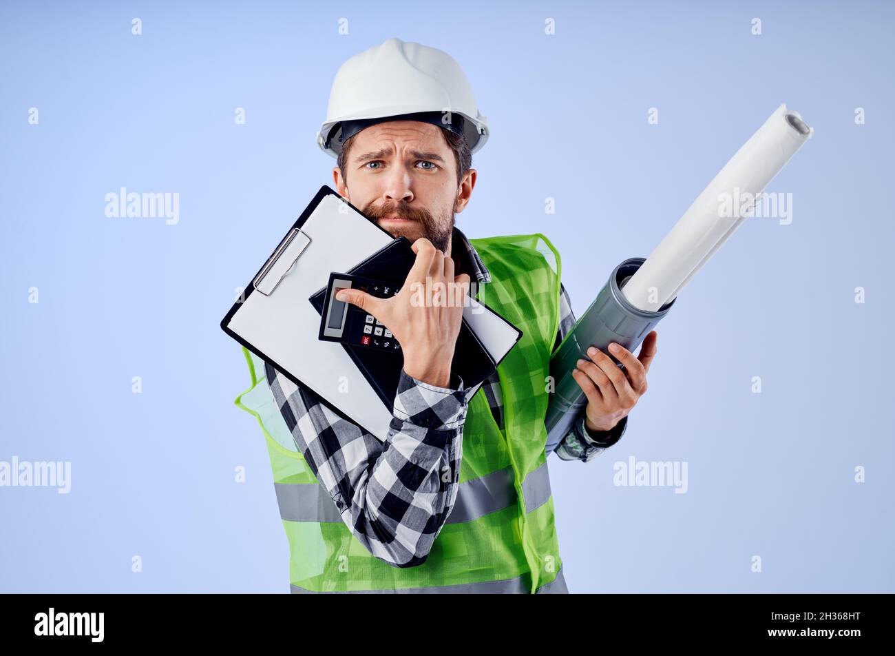 engineer with documents and drawings blueprints isolated background ...