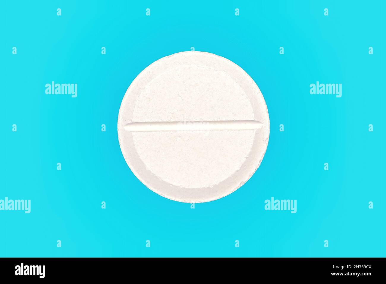 White pill or dietary supplement isolated on blue background Stock ...