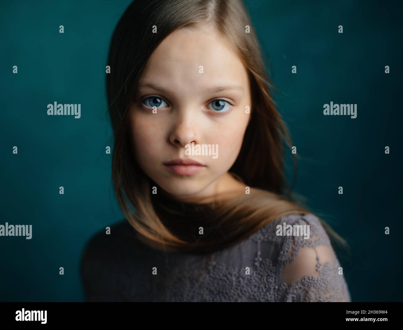 cute girl emotions depression green background Stock Photo - Alamy
