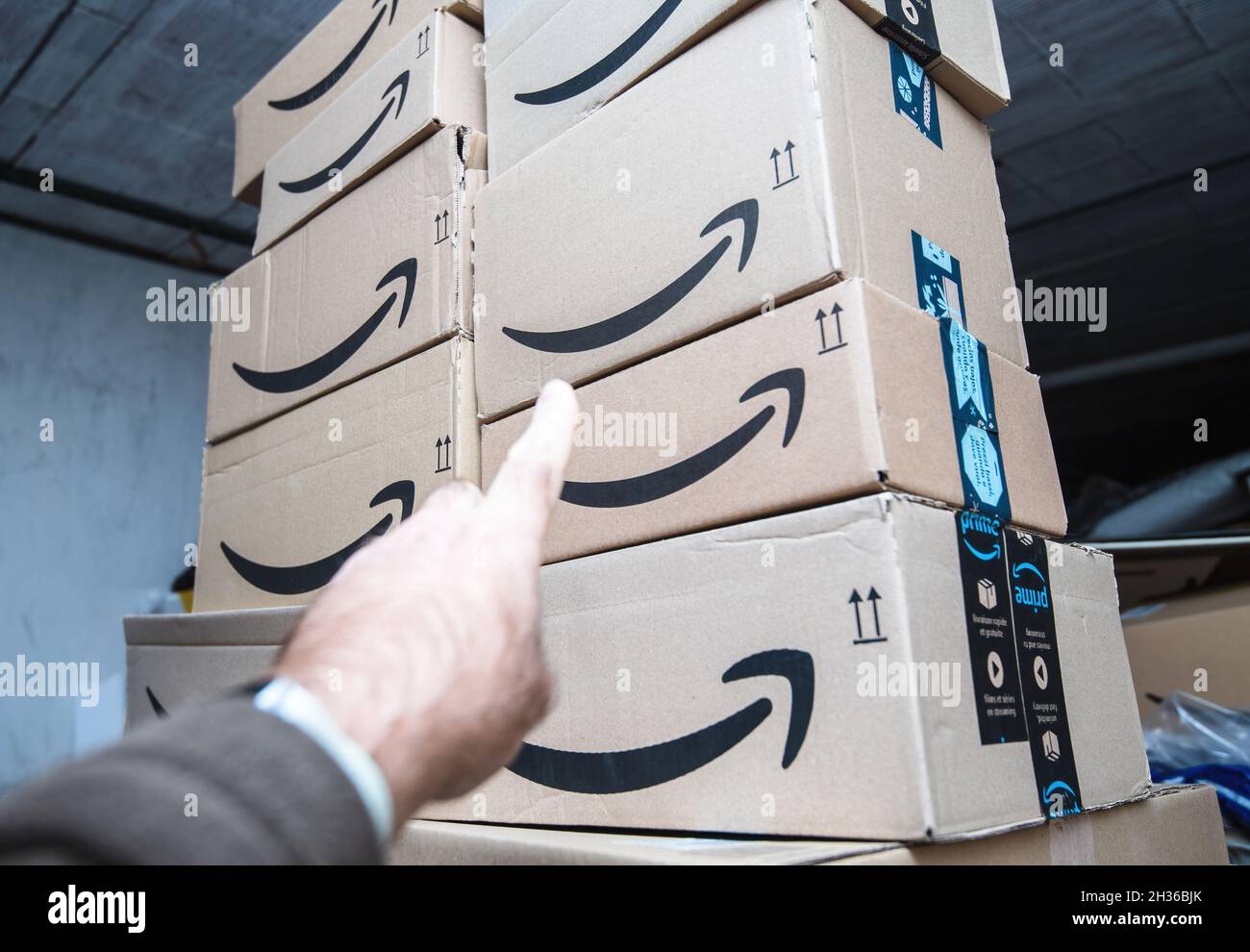 POV male hand showing to large pile stack in garage of Amazon Prime ...