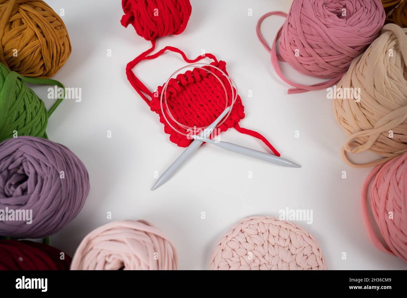 cotton yarn knitting pattern on white table Stock Photo - Alamy