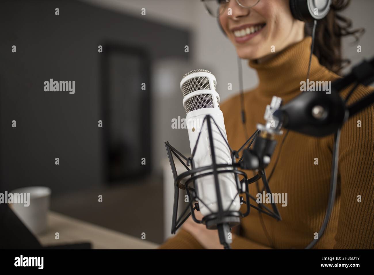 woman broadcasting radio while smiling. Resolution and high quality ...