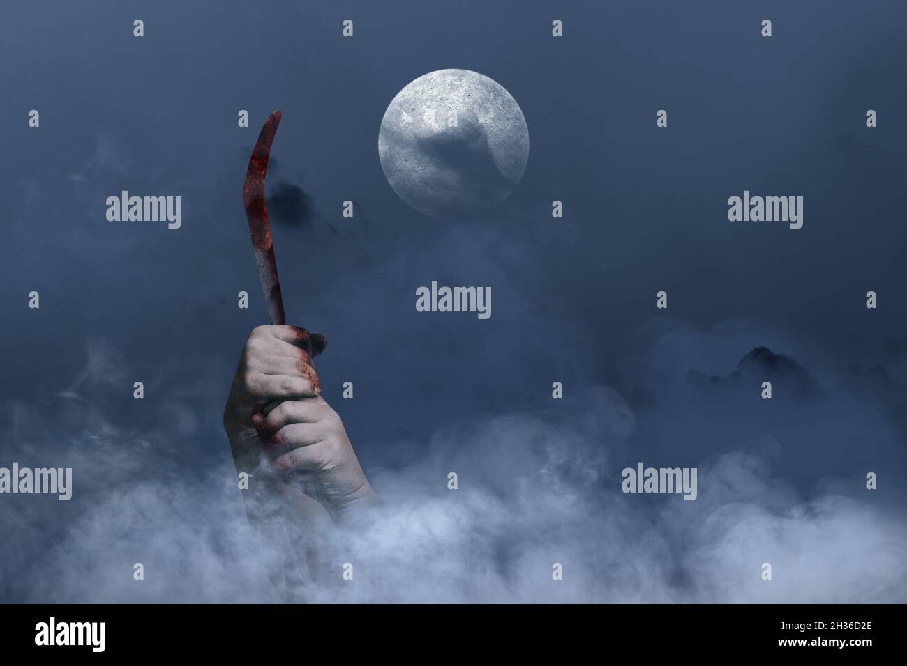 Zombie hands with wound holding sickle with the night scene background ...