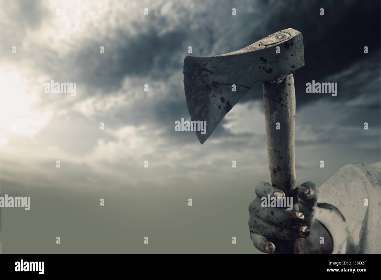 Zombie hands with wound holding ax with the dramatic scene background ...
