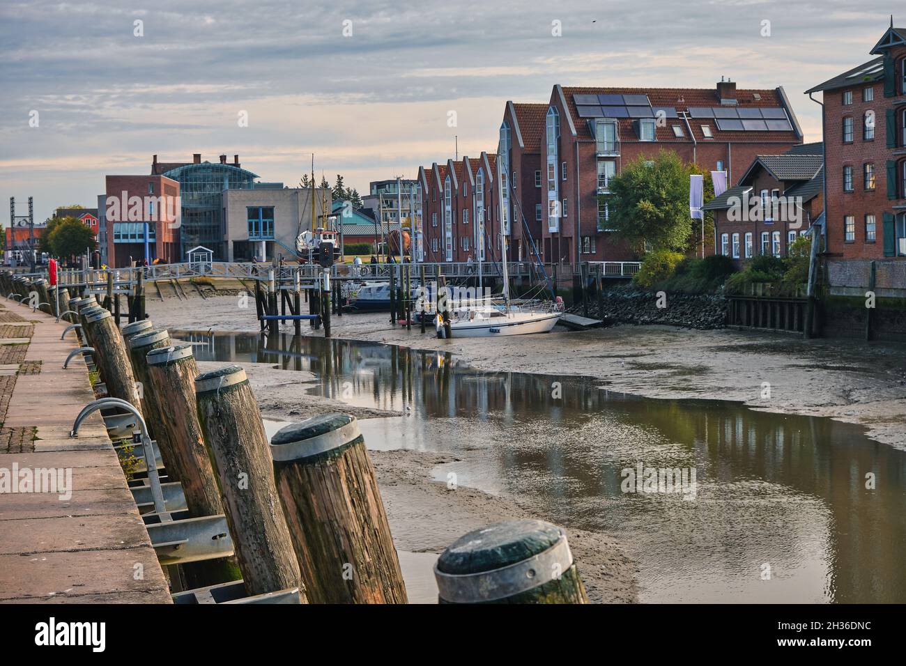 Husum harbor at ebb tide in the marshes, Germany Stock Photo - Alamy