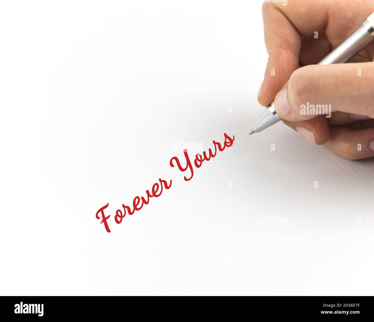 Hand writing "Forever Yours" on white sheet of paper Stock Photo - Alamy