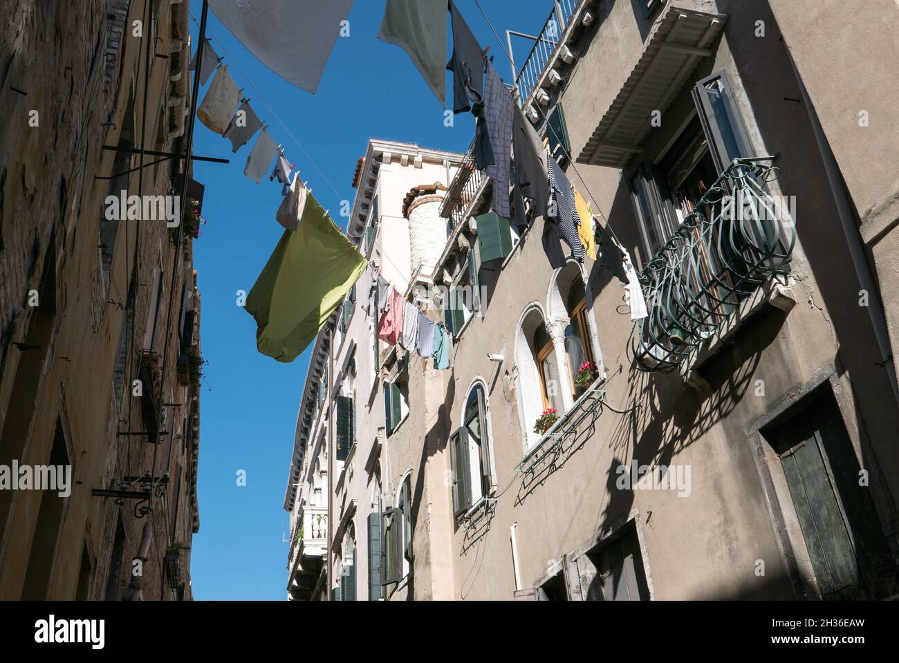 VENICE, ITALY - Oct 03, 2021: The laundry hanging on a line between the ...