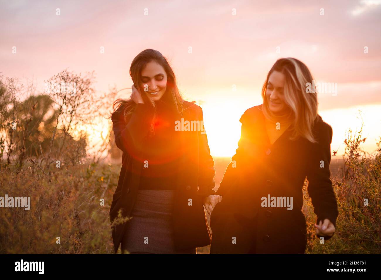Two best friends holding hands hi-res stock photography and images - Alamy