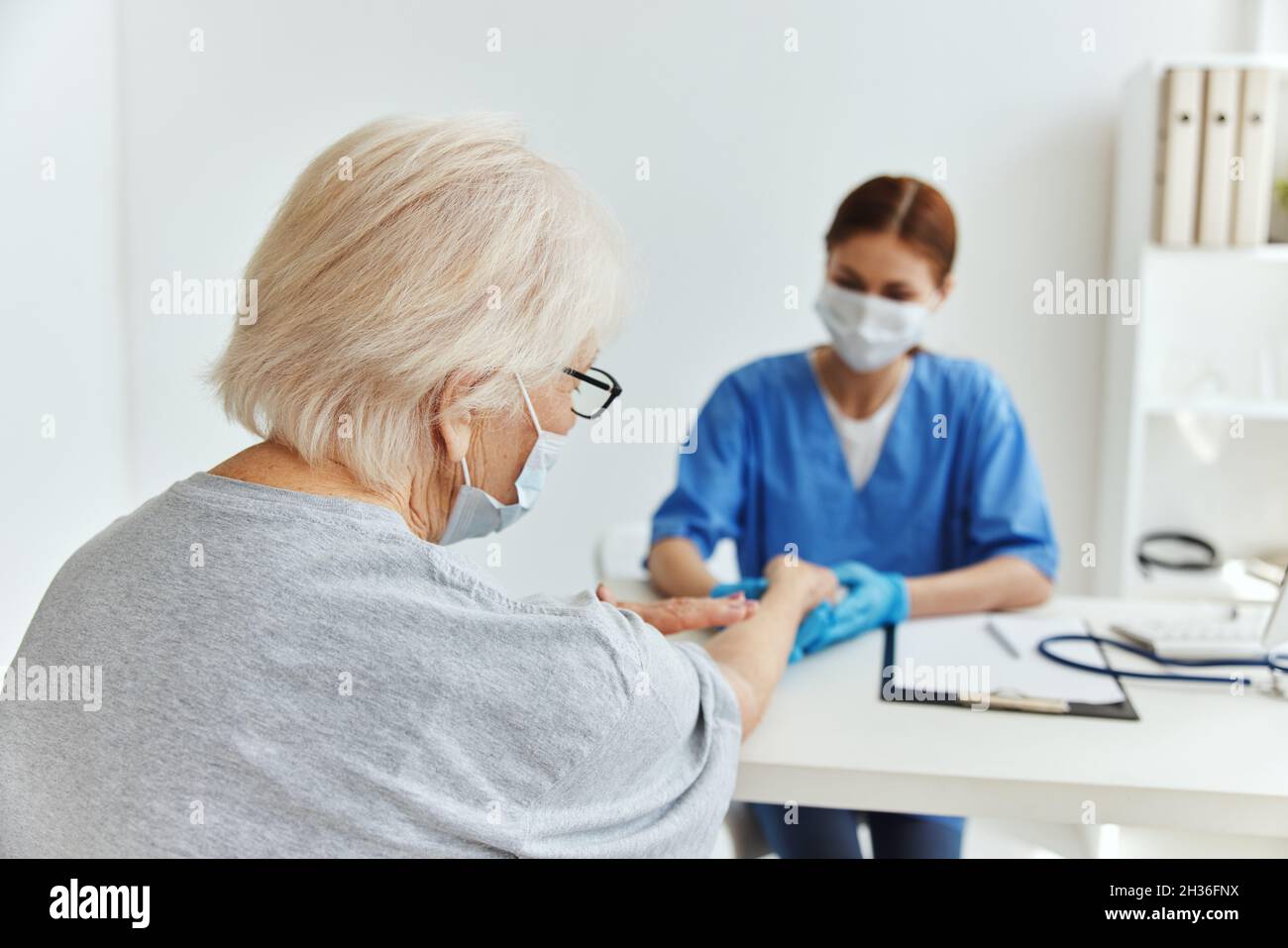 nurse and patient Hospital visit medical office Stock Photo - Alamy