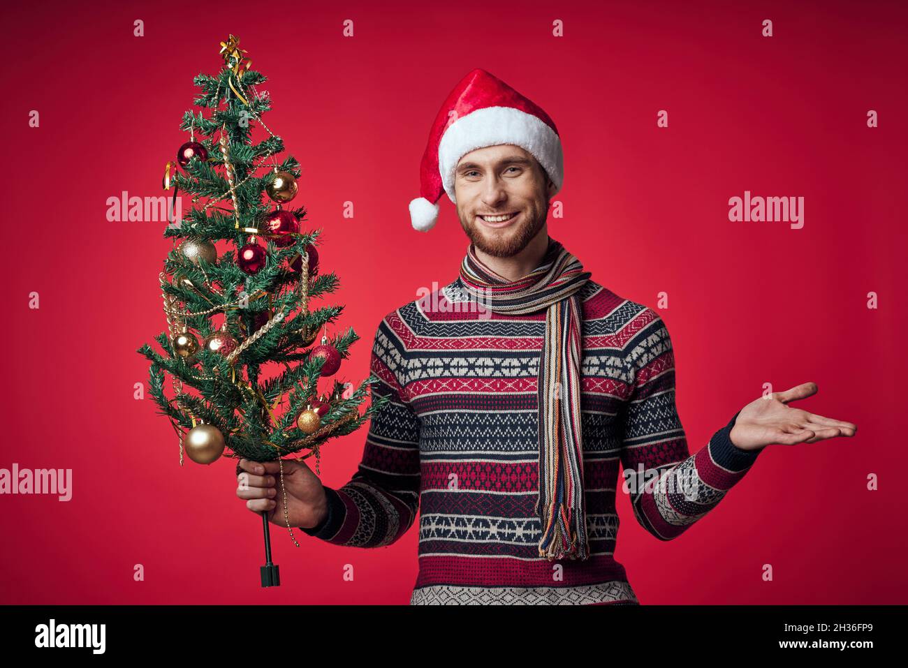 cute man in christmas clothes christmas tree toys lifestyle Stock Photo ...