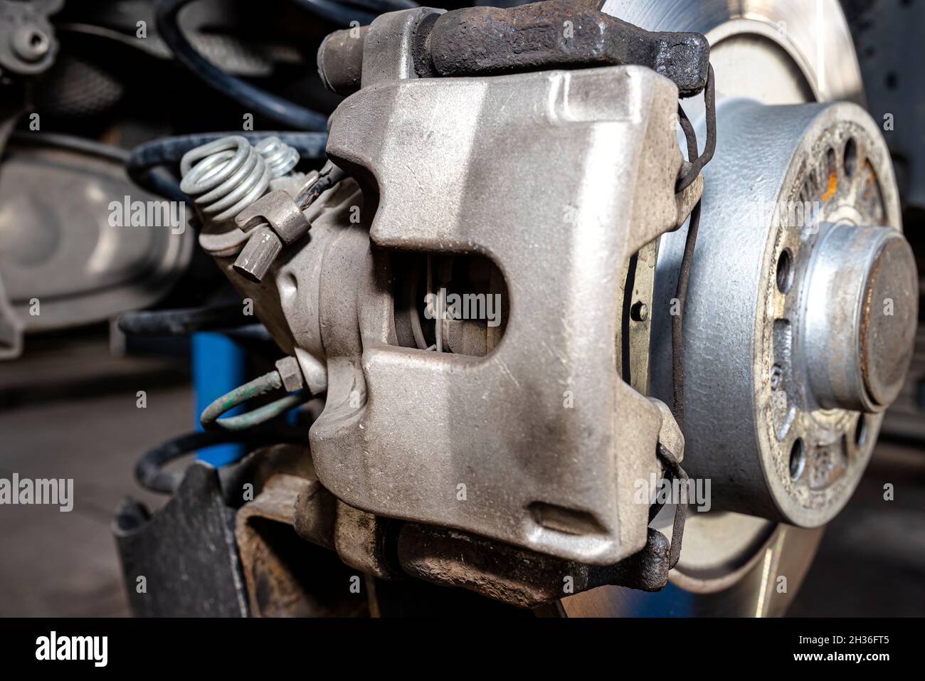 New rear brake calipers and brake discs with pads in a passenger car ...