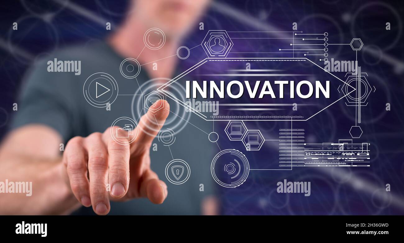 Man touching an innovation concept on a touch screen with his finger ...