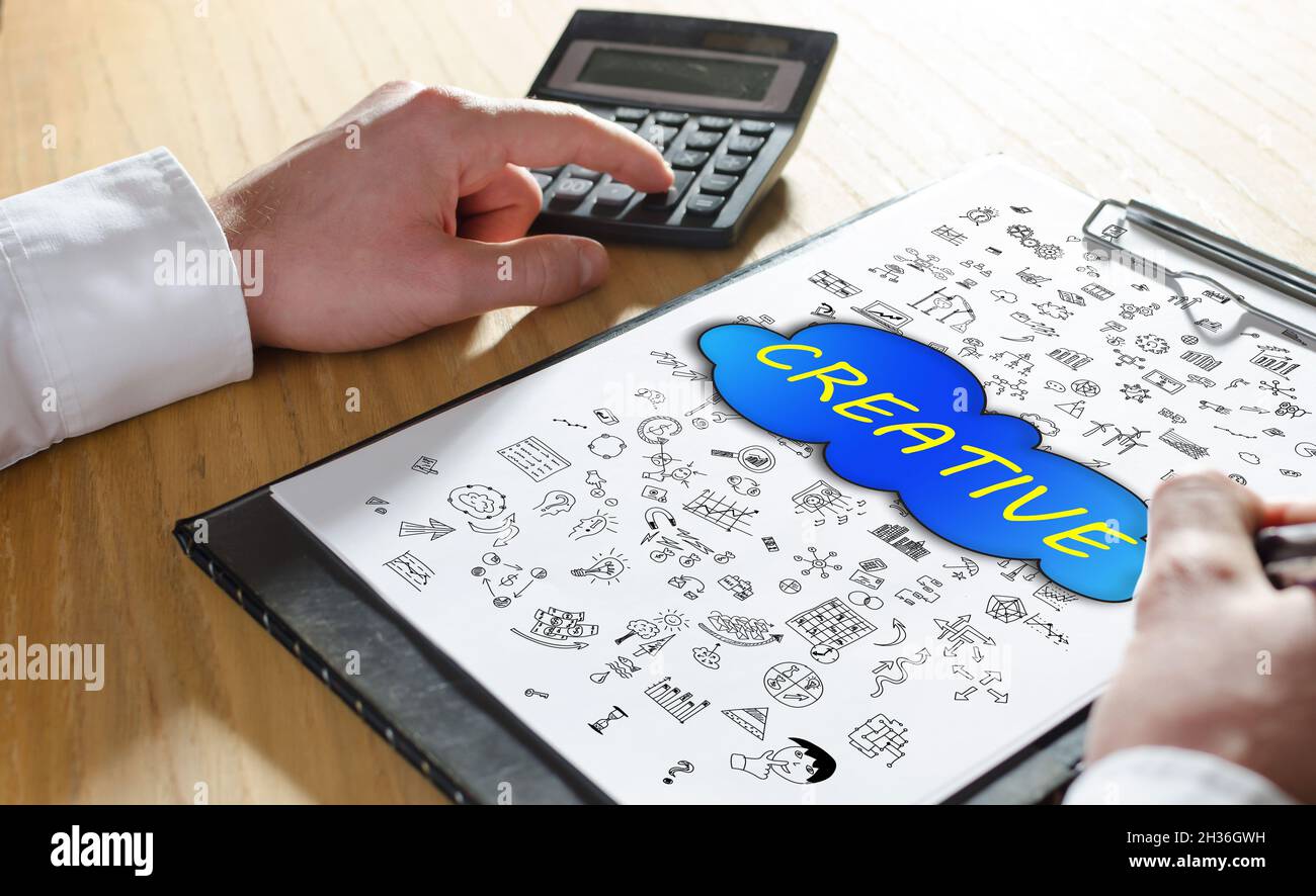 Creativity concept with hand using a calculator Stock Photo - Alamy