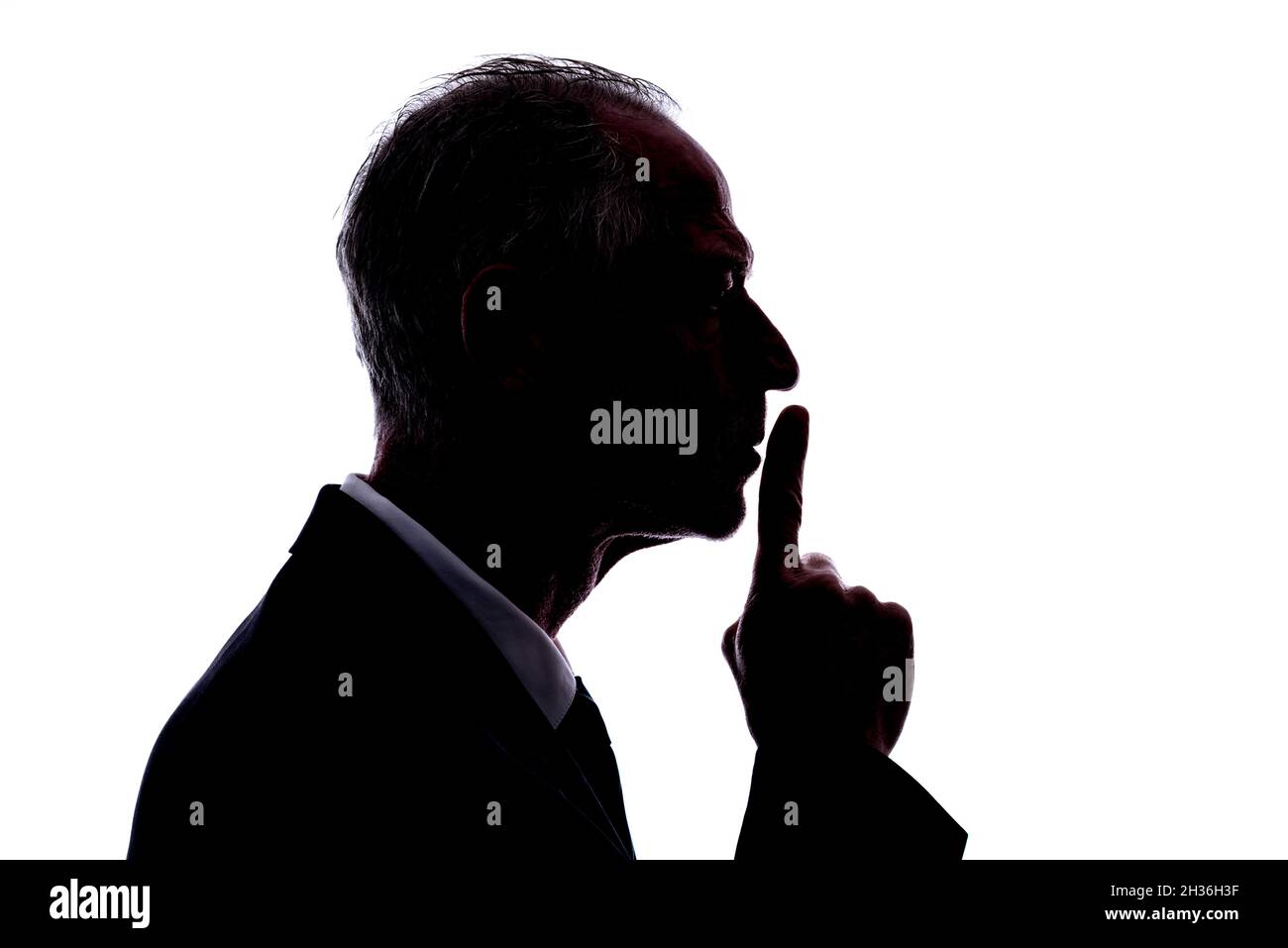 Silhouette of a man expressing the silence Stock Photo - Alamy