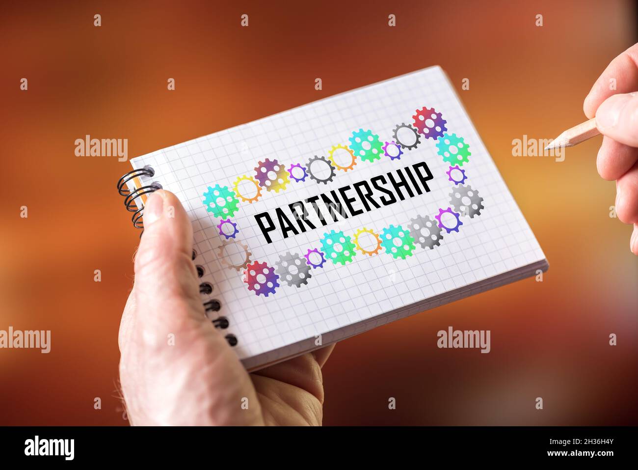 Hand drawing partnership concept on a notepad Stock Photo - Alamy