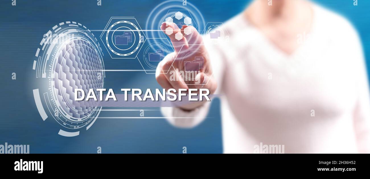 Woman touching a data transfer concept on a touch screen with her ...