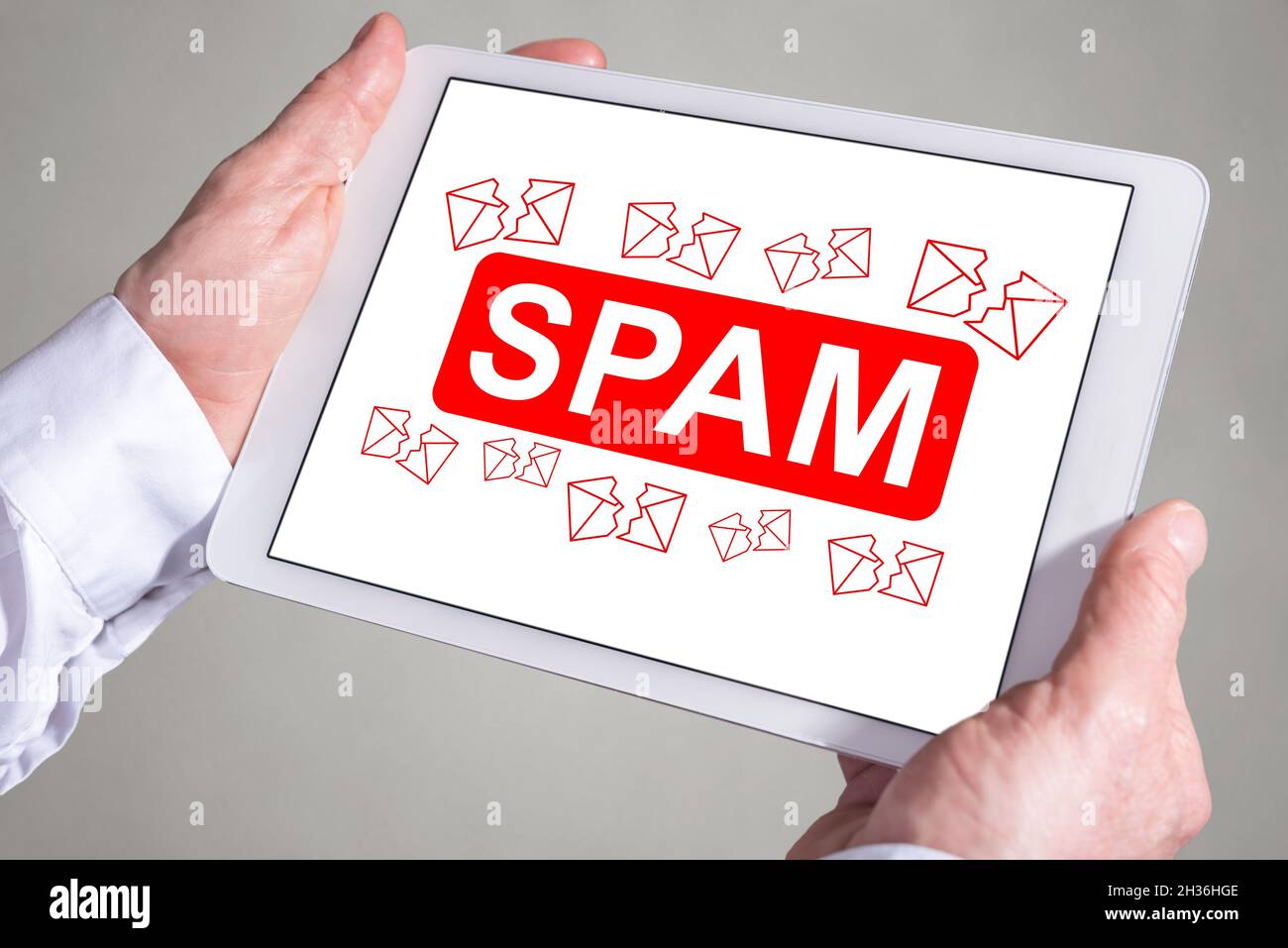 Tablet screen displaying a spam concept Stock Photo - Alamy