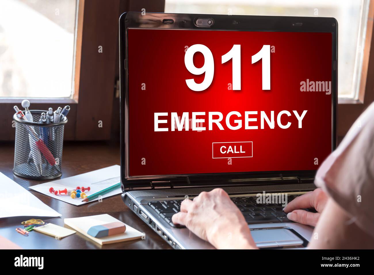 Laptop screen displaying an emergency concept Stock Photo - Alamy