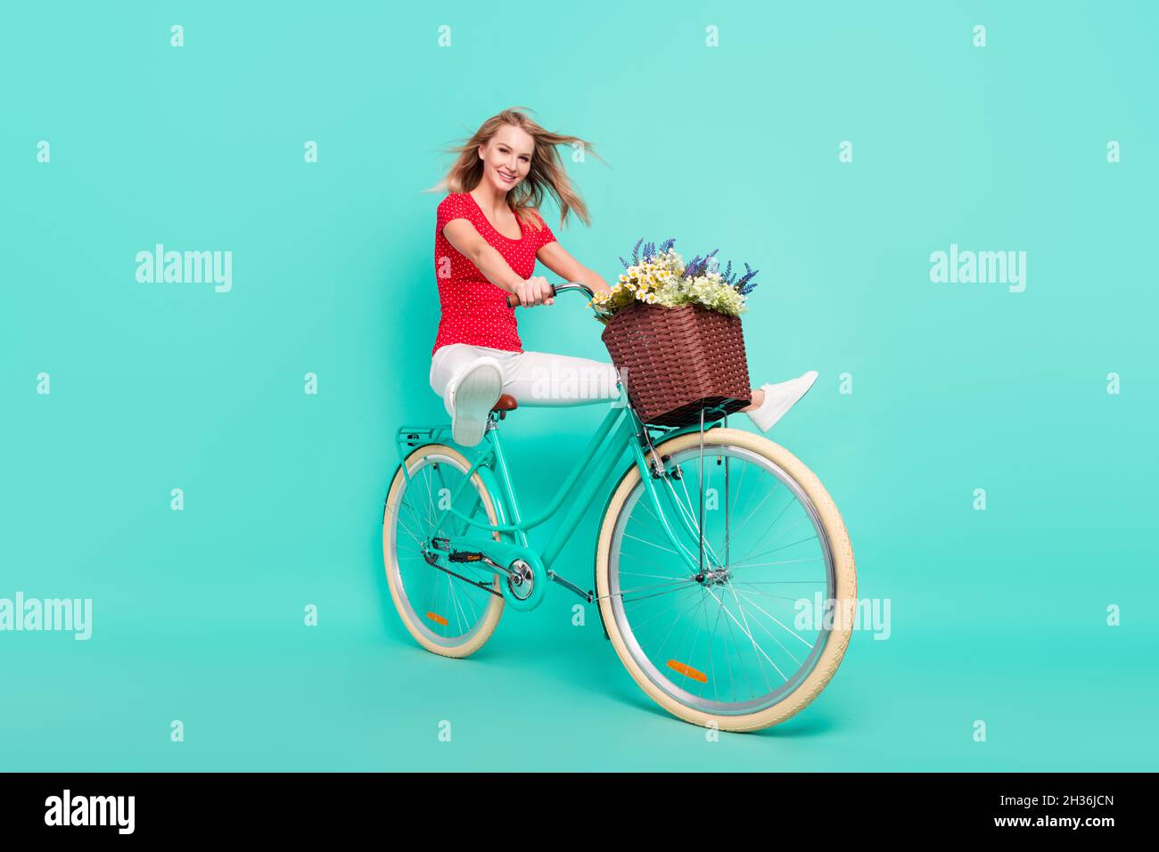 Full length profile side photo of young woman happy smile ride bicycle ...