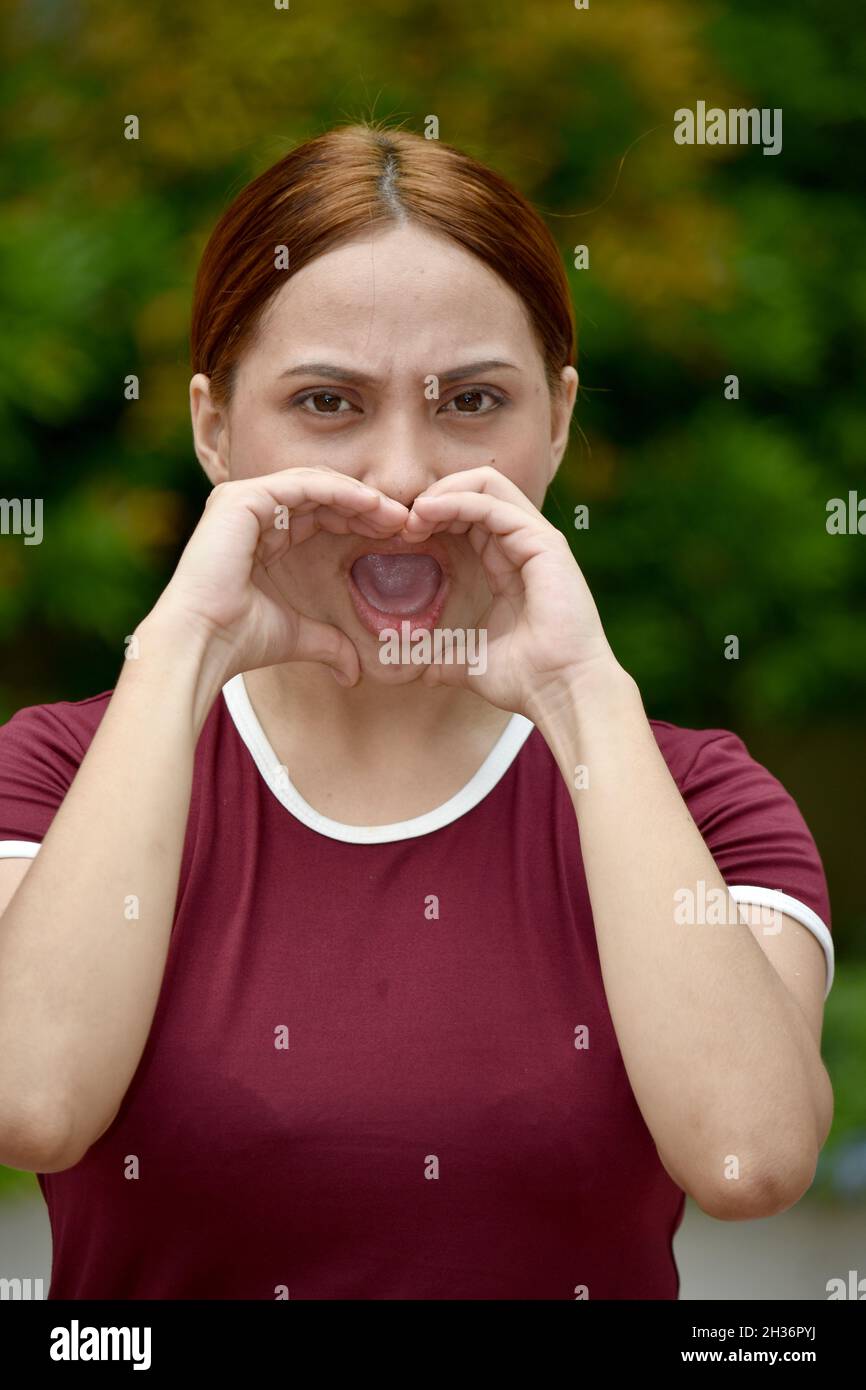 Young Filipina Female Shouting Wearing Tshirt Stock Photo - Alamy