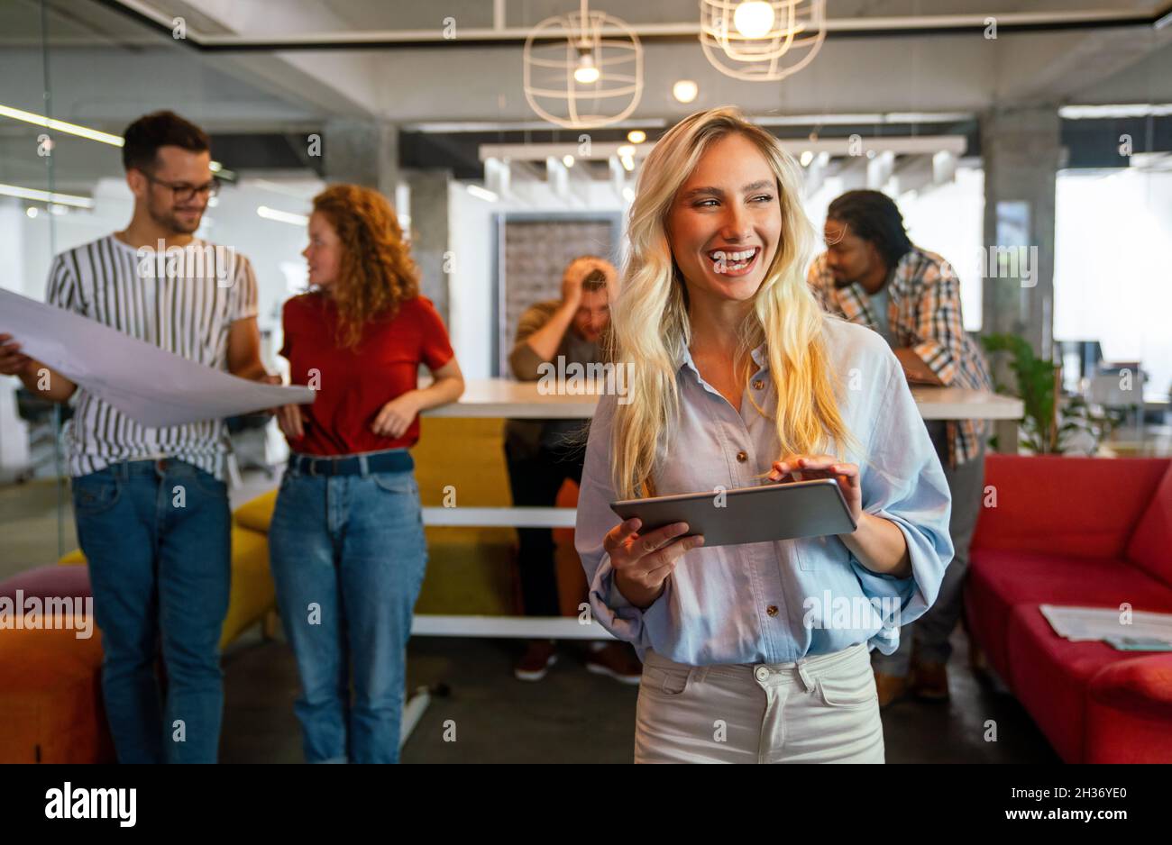Group of happy business people working together on project in office ...