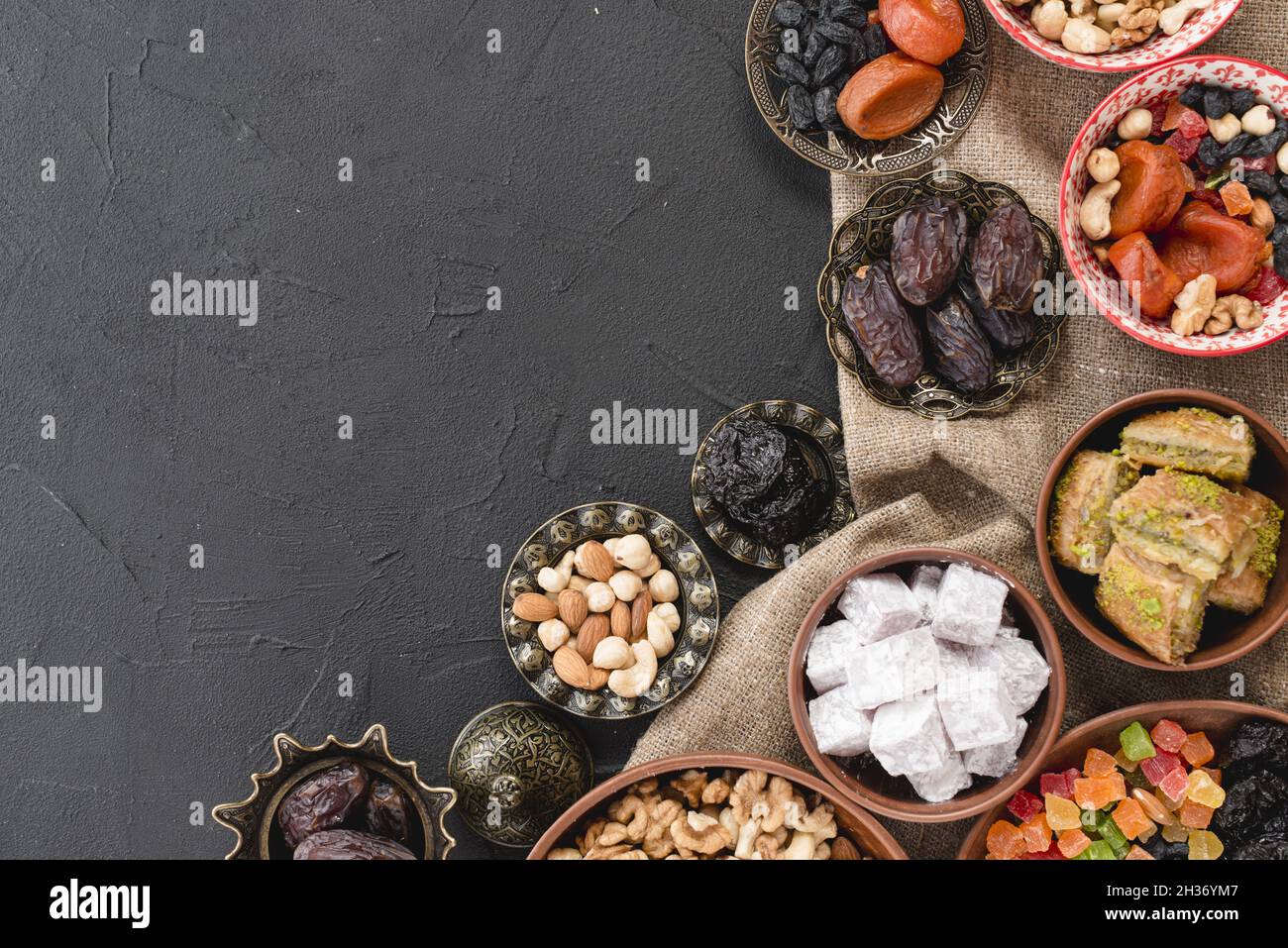traditional ramadan dessert nuts metallic earthen bowl black backdrop ...