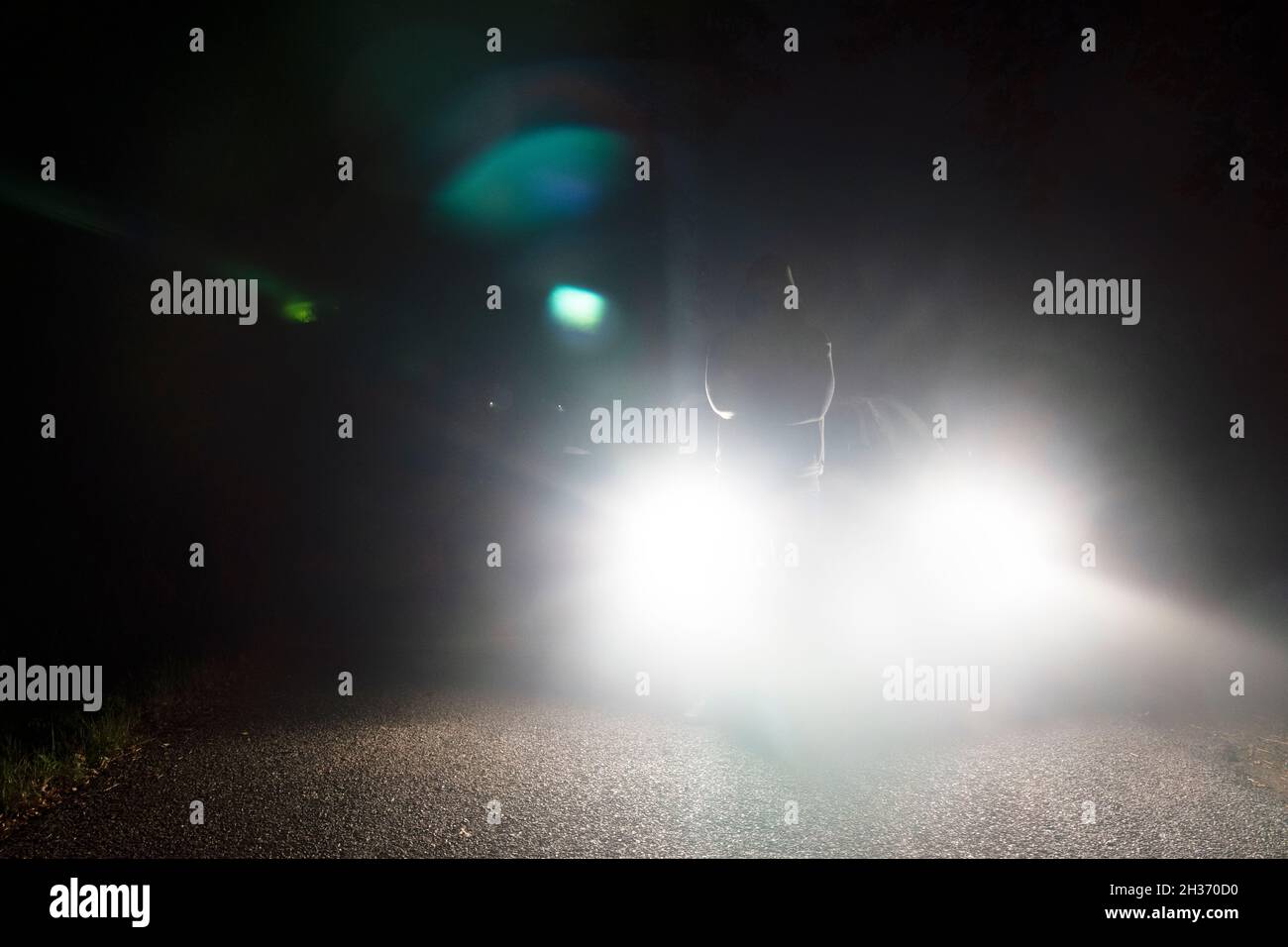 Man standing in front headlights hi-res stock photography and images ...