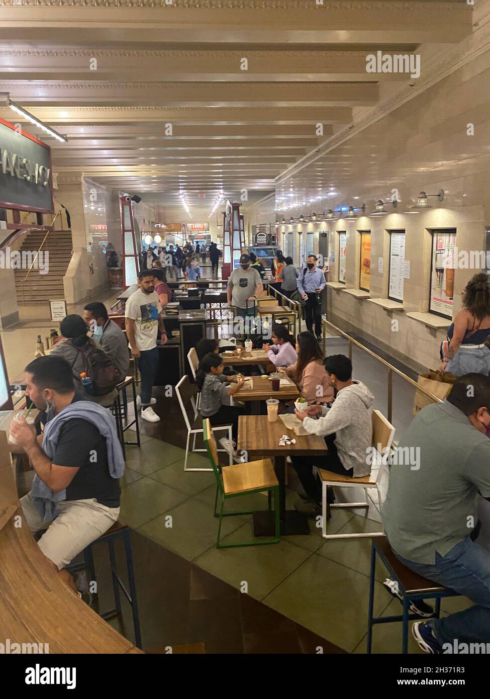 People eating in the dining concourse below the main hall at Grand ...