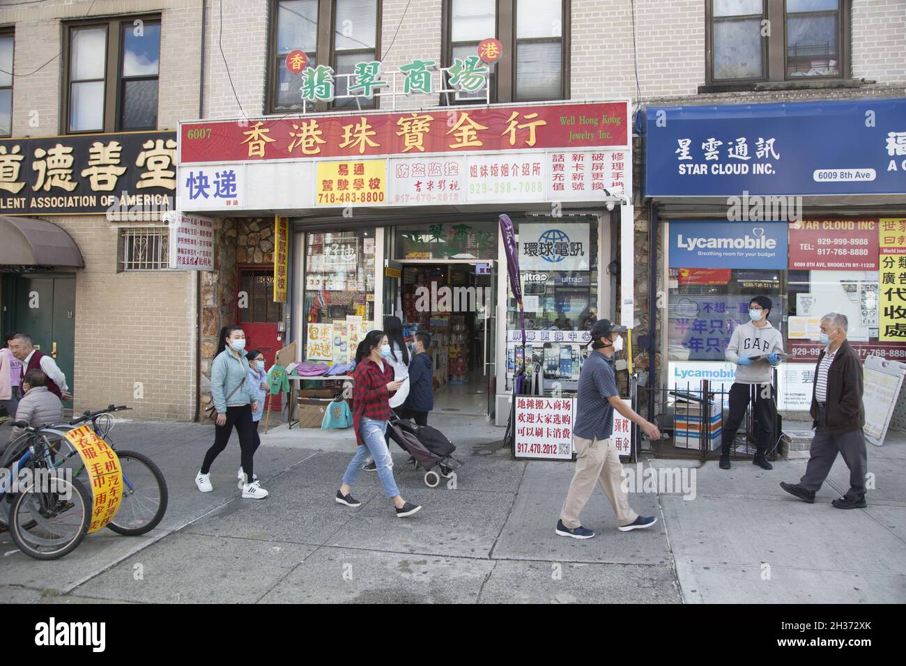 Residents out and about along 8th Avenue in the Chinatown neighborhood ...