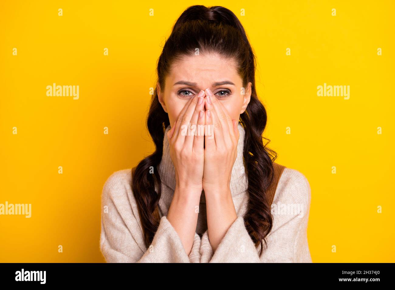 Close-up portrait of attractive worried nervous girl closing face ...