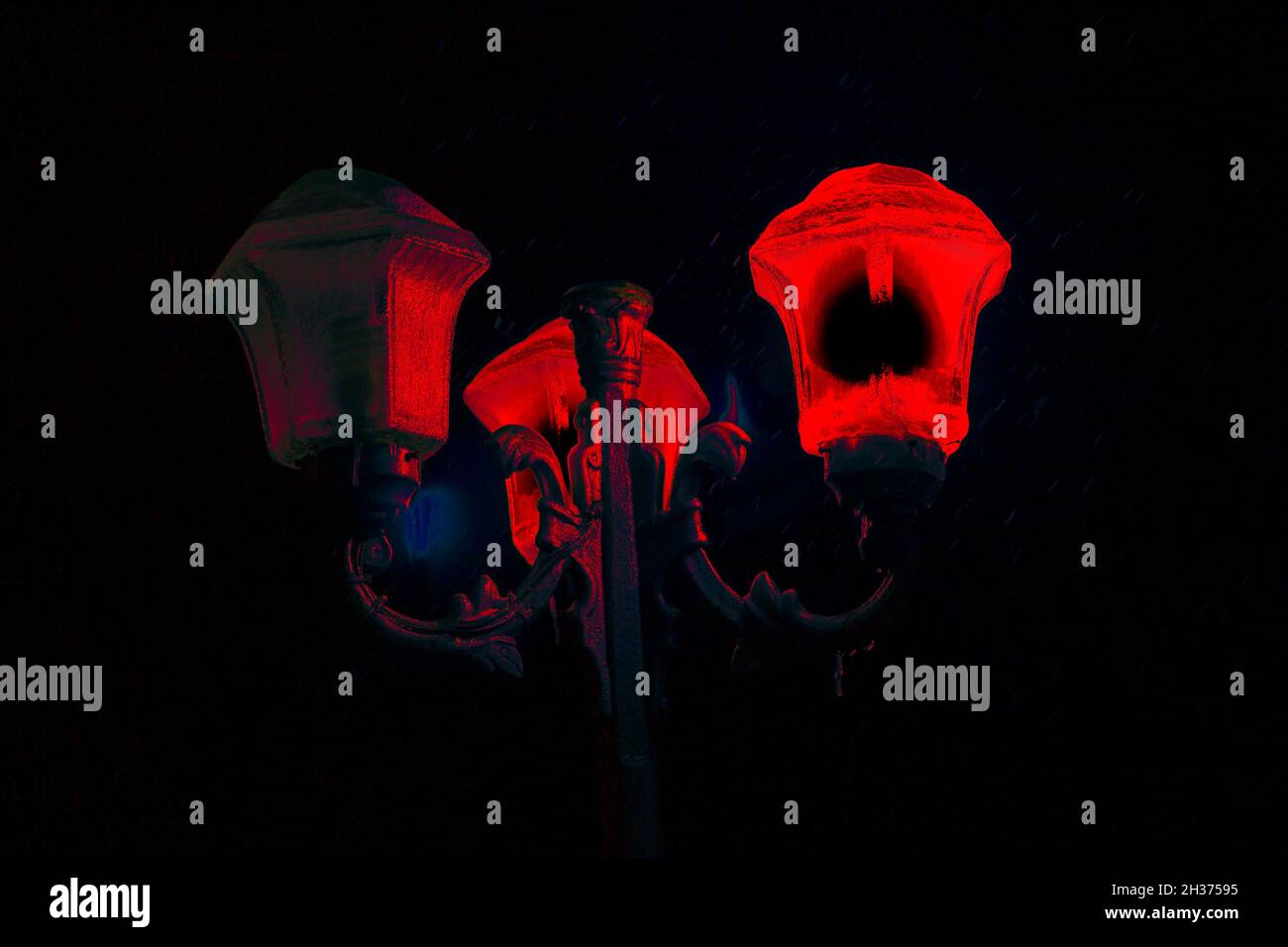 Red street light in the night . Street illumination with light lantern ...