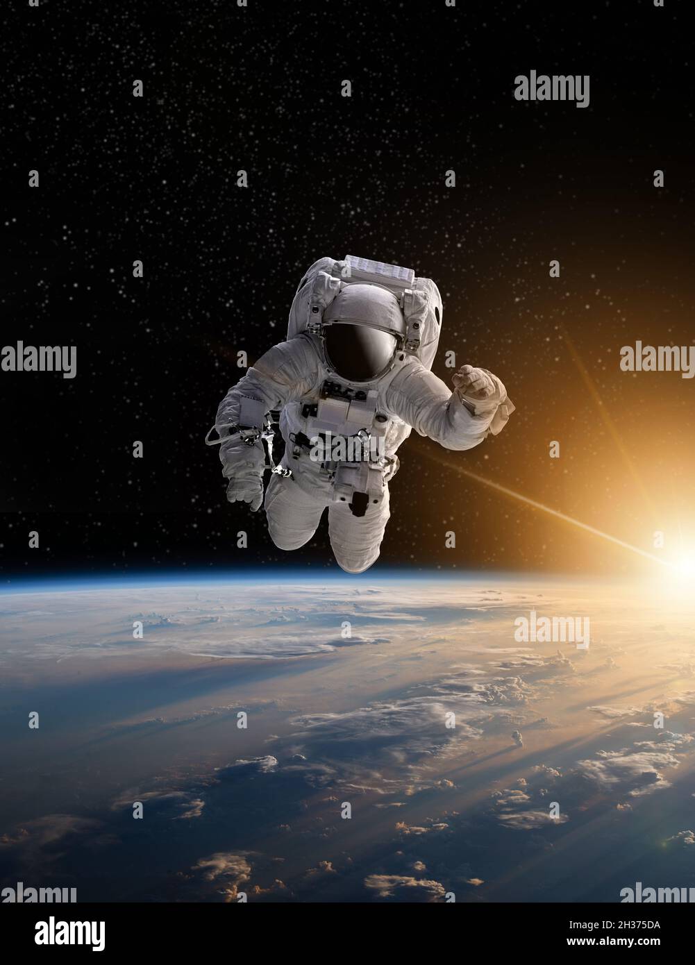 Astronaut in outer space over the planet Earth.Stars provide the ...