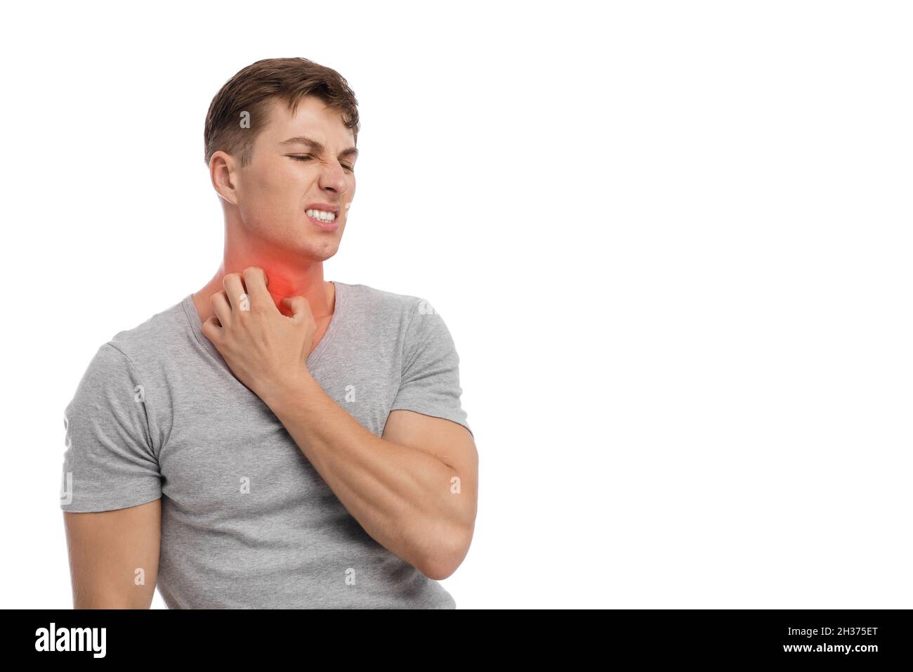 Sad young caucasian guy scratching neck, suffer from allergy, isolated ...