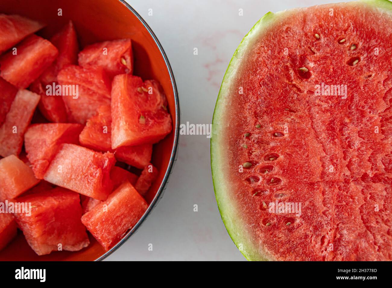Half Watermelon and chunks of watermelon ready to eat Stock Photo - Alamy