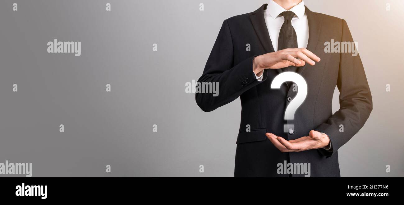 Male hand holding question mark icon on neon red,blue,purple background ...