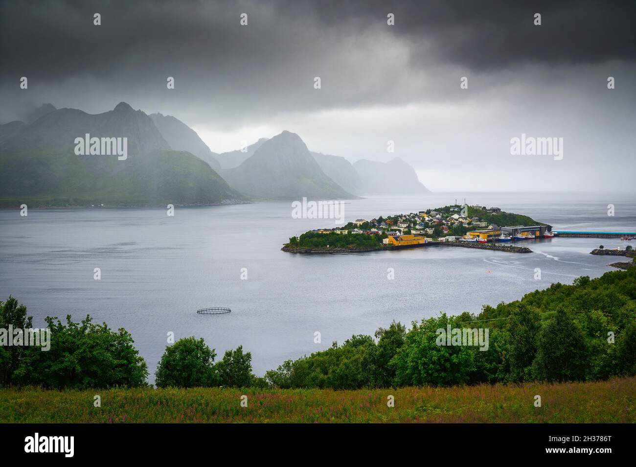 Husoy fishing village on the Senja Island in Norway with in heavy ...