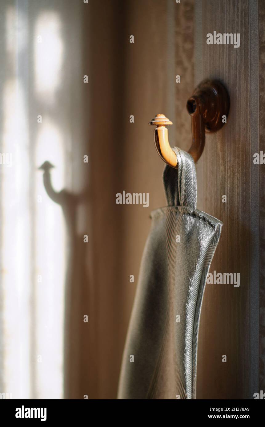 The curtain bell hanging on the hook Stock Photo - Alamy