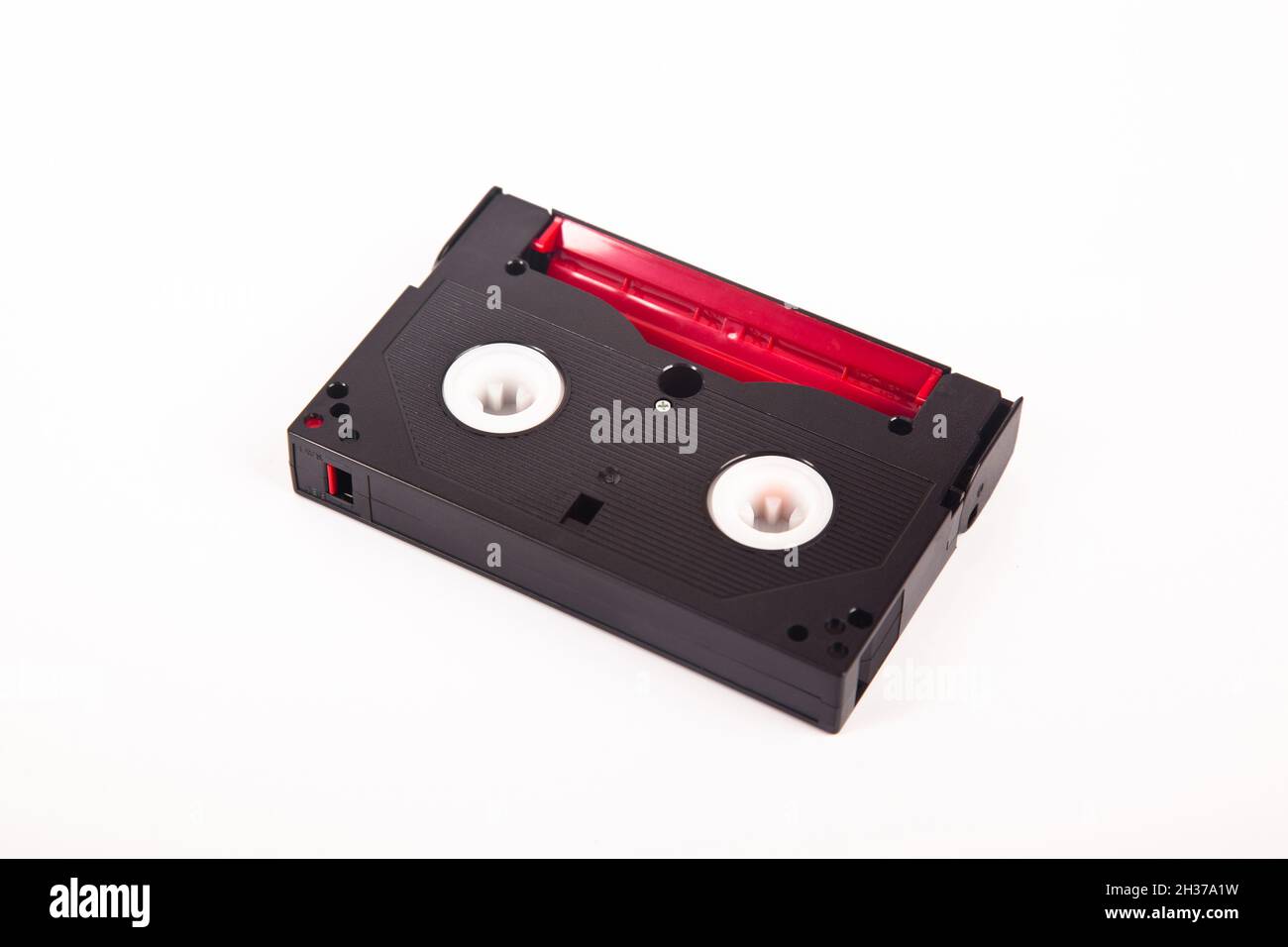 Small old black MiniDV format video cassette, isolated on white ...