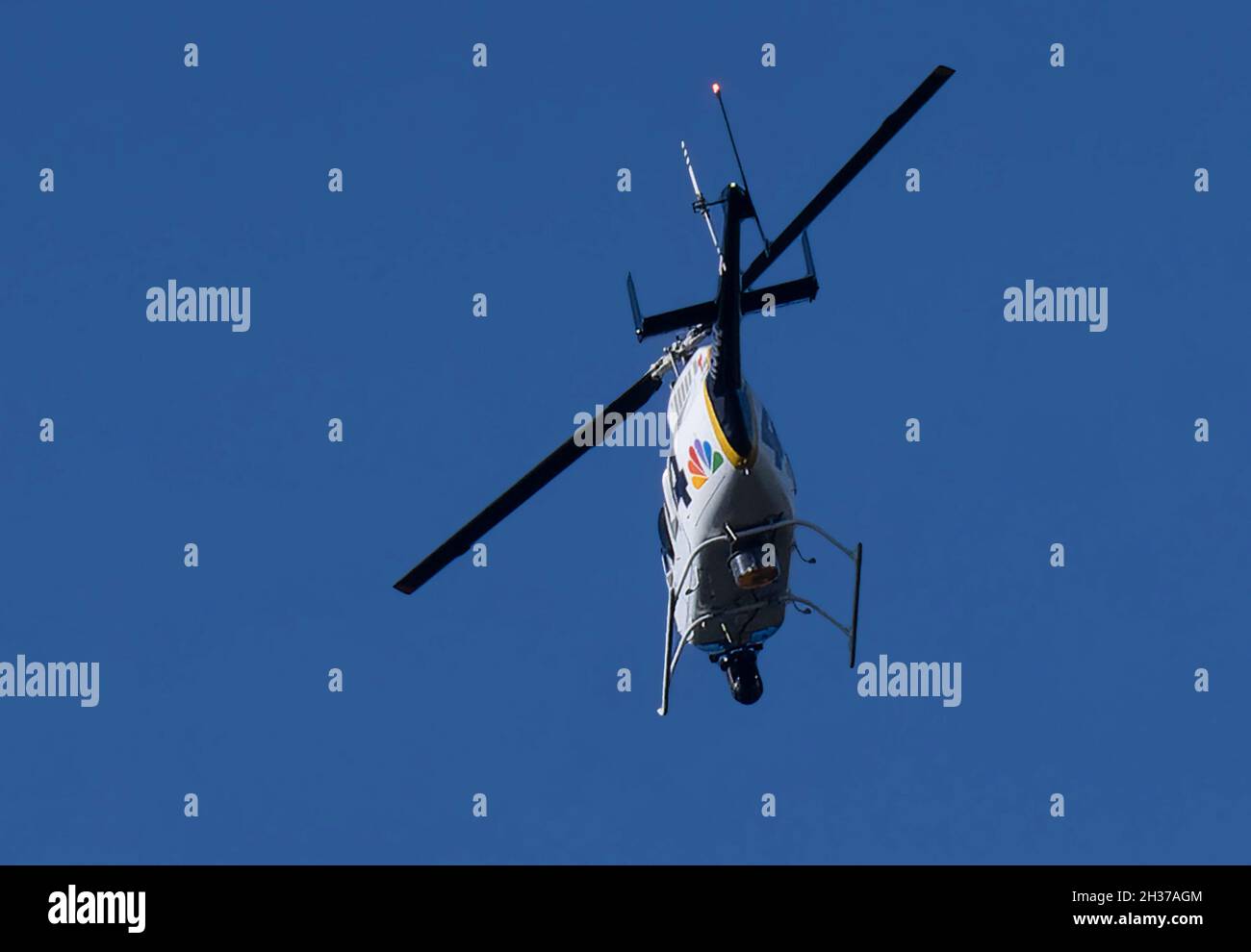 Television news gathering helicopter overhead Stock Photo - Alamy